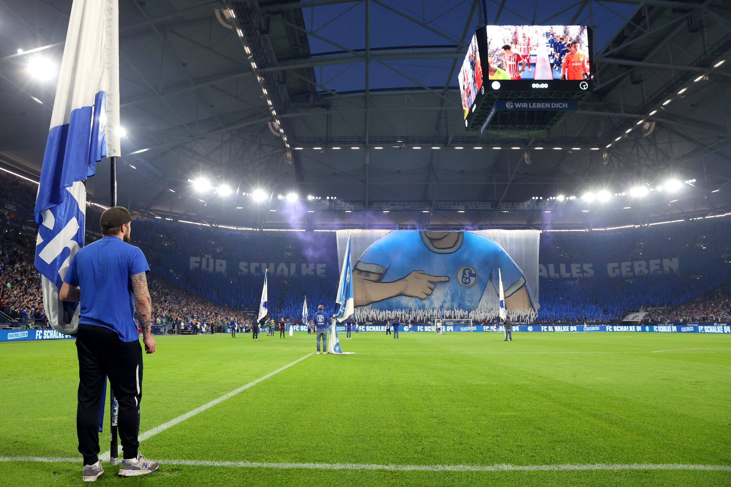 Greatest tifos: Schalke fans turn giant white shirt blue using smoke bombs