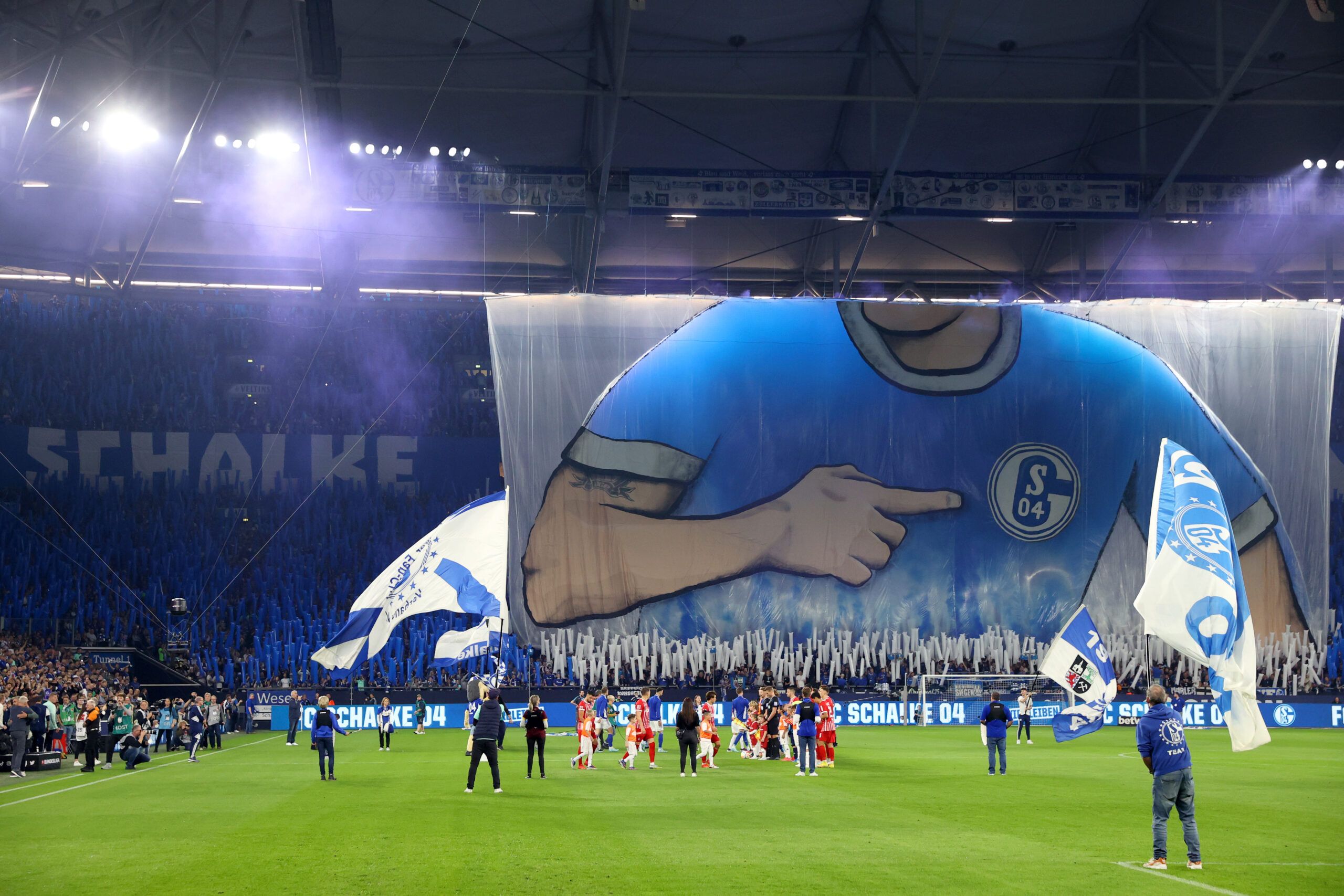 Greatest tifos: Schalke fans turn giant white shirt blue using smoke bombs