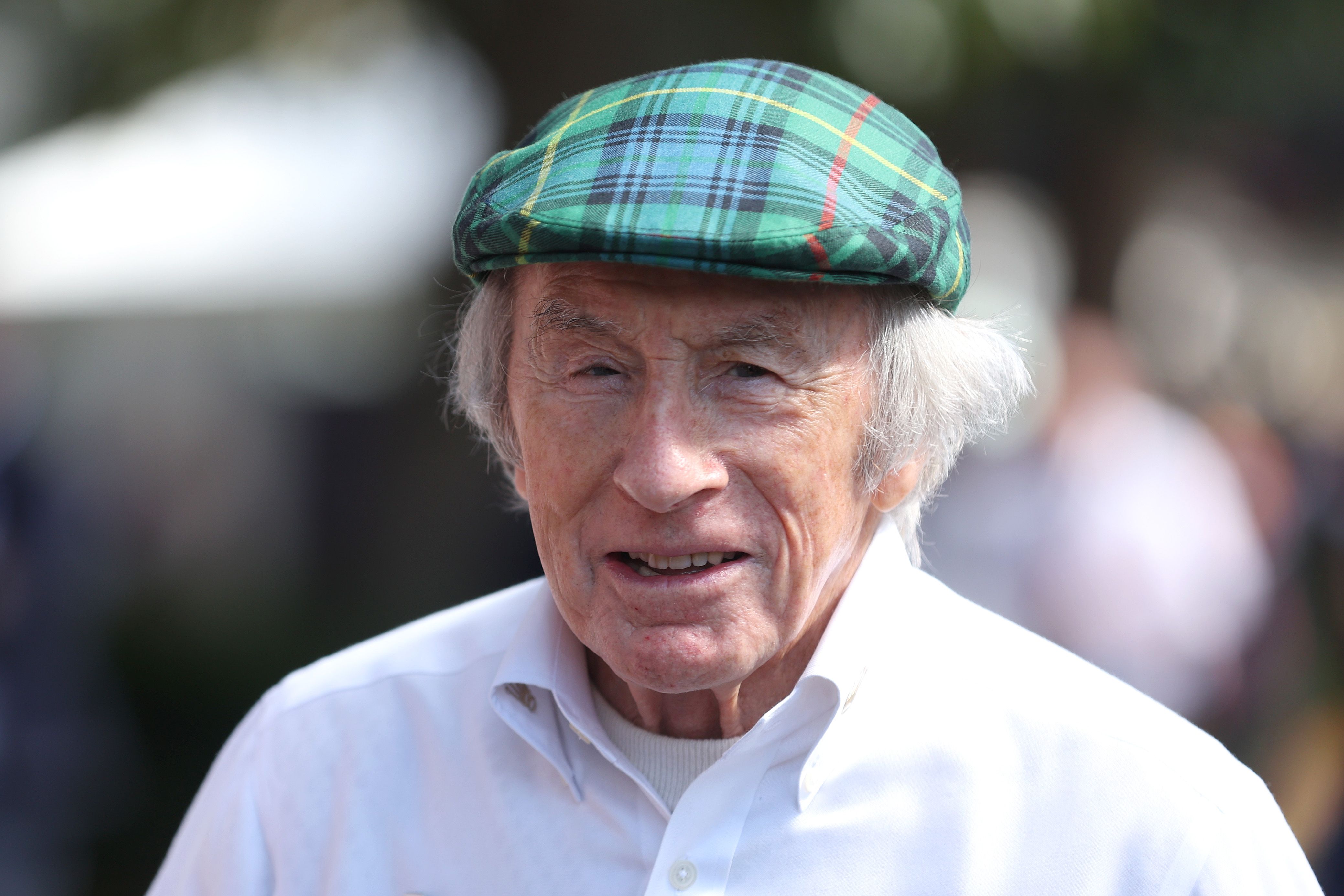 Miami GP: Jackie Stewart evades security to grab Roger Federer for ...