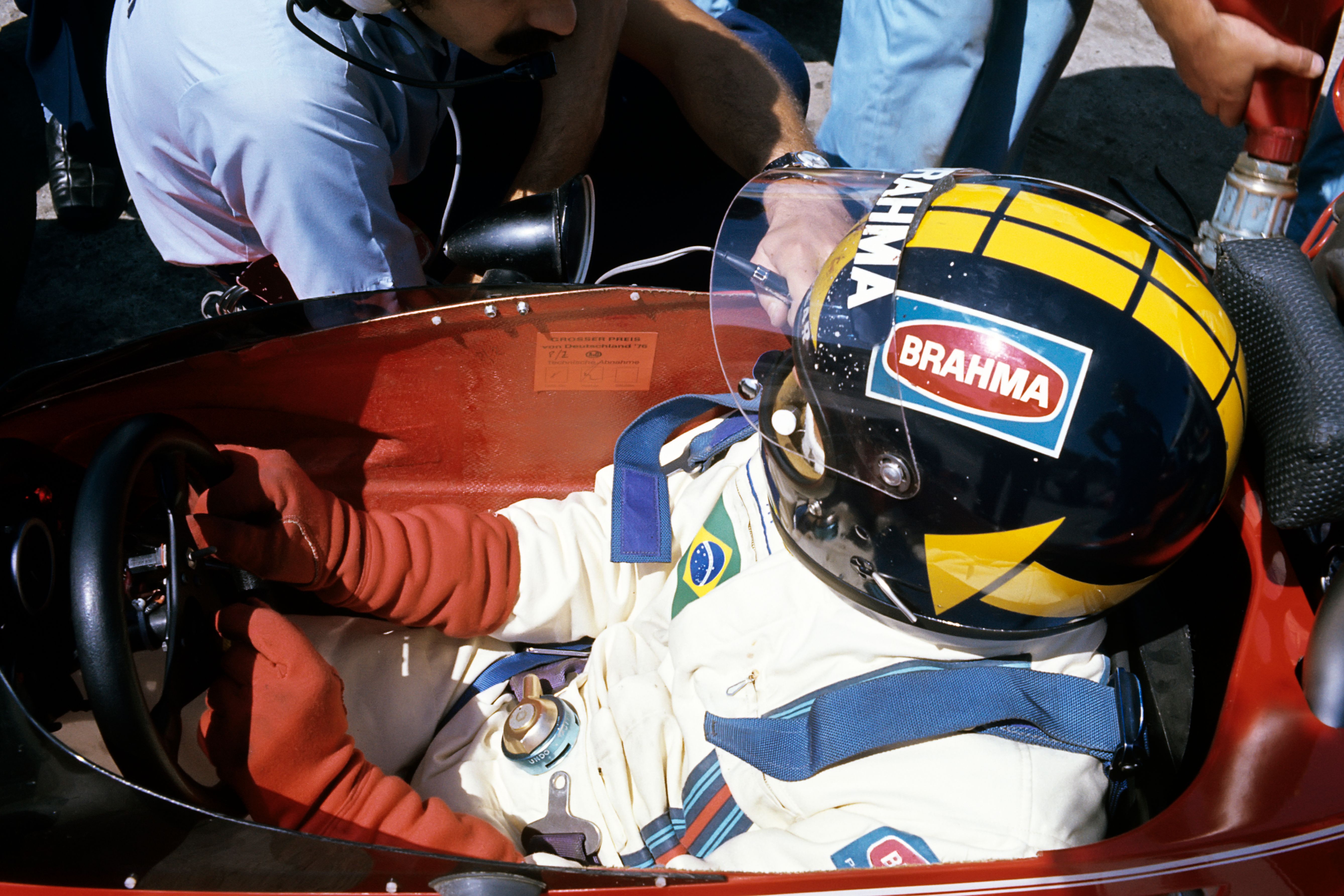 How do F1 drivers sit?