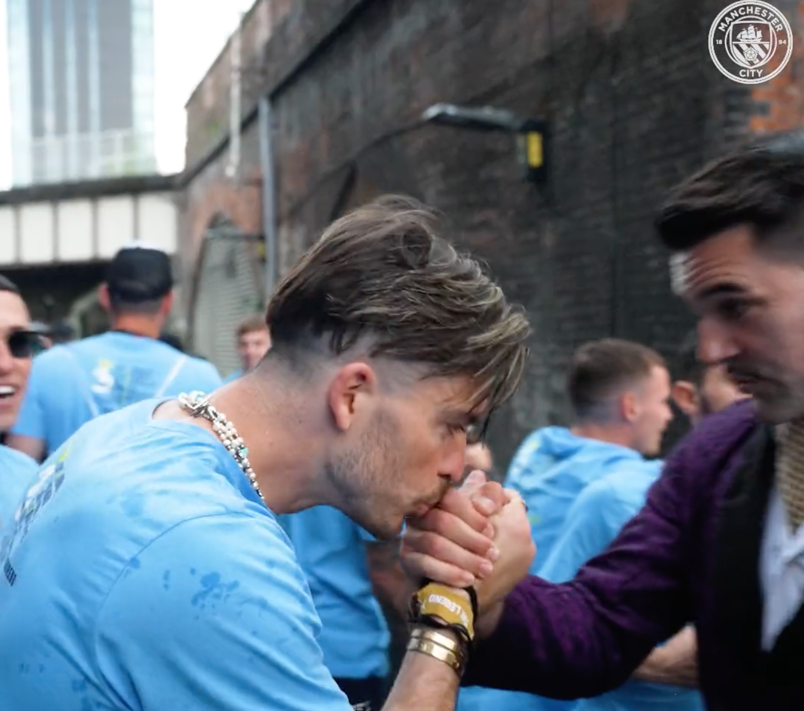Man City squad being greeted by comedian Troy Hawke on open-top parade ...