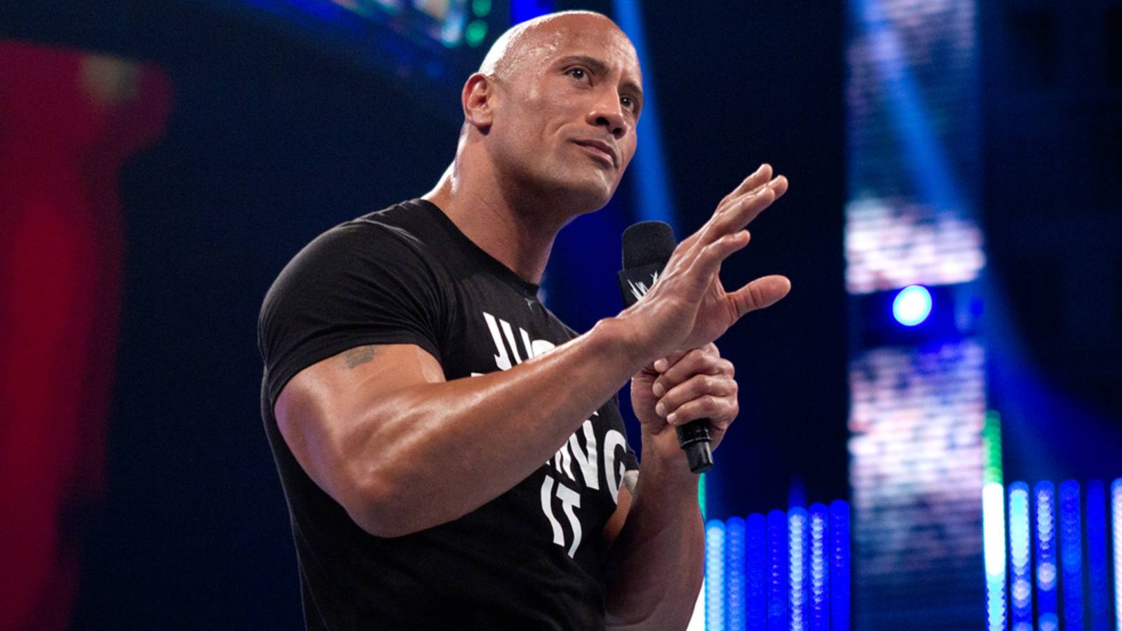 The Rock confronts Triple H after WWE press conference
