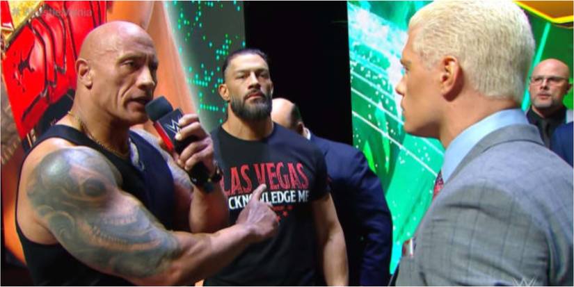 The Rock confronts Triple H after WWE press conference