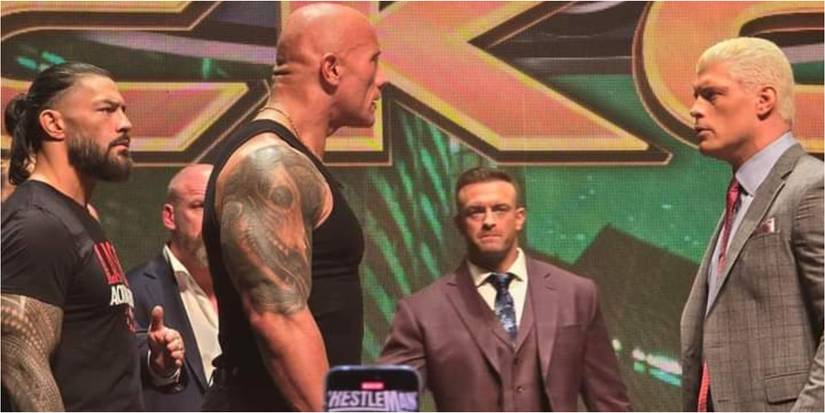 The Rock confronts Triple H after WWE press conference