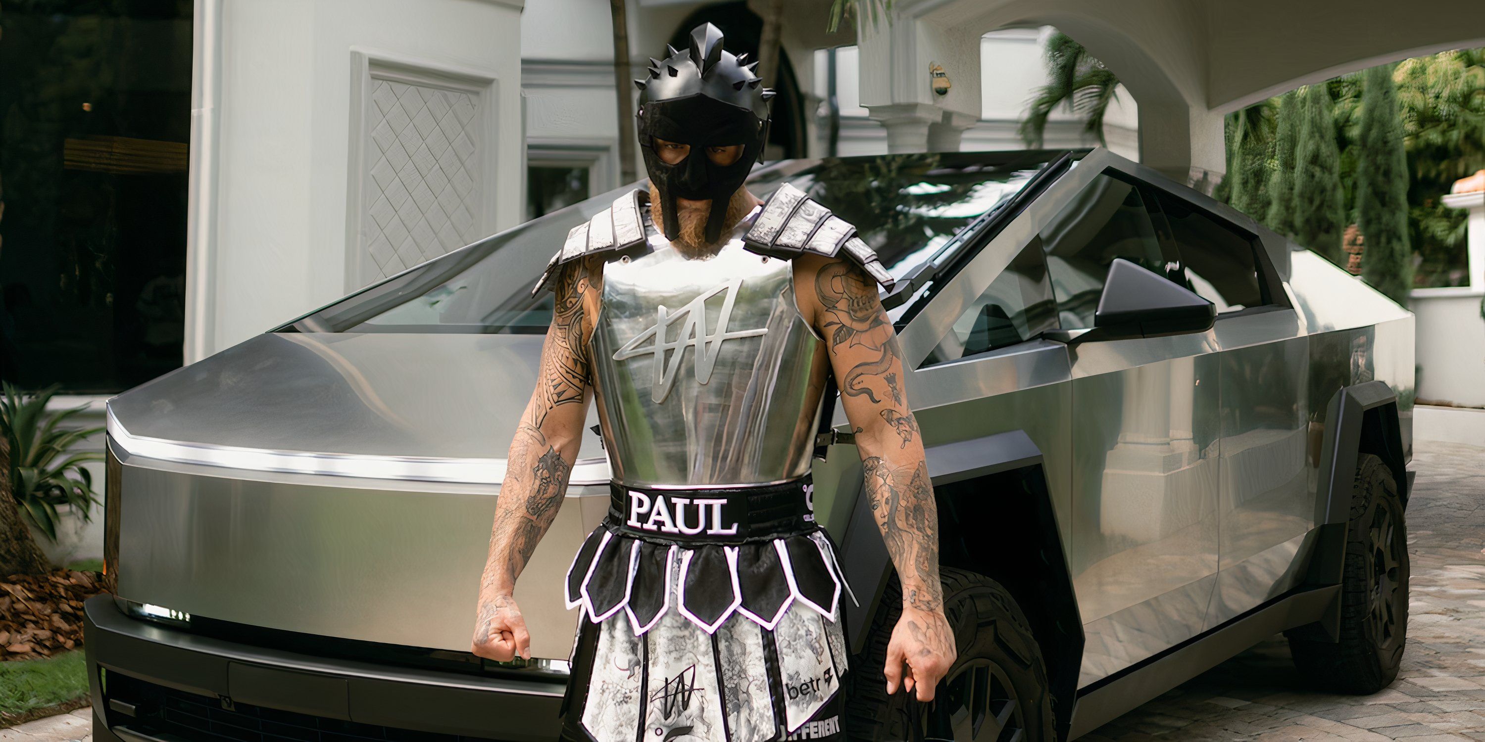 Jake Paul Unveils Ring-Walk Outfit in Front of a Cybertruck