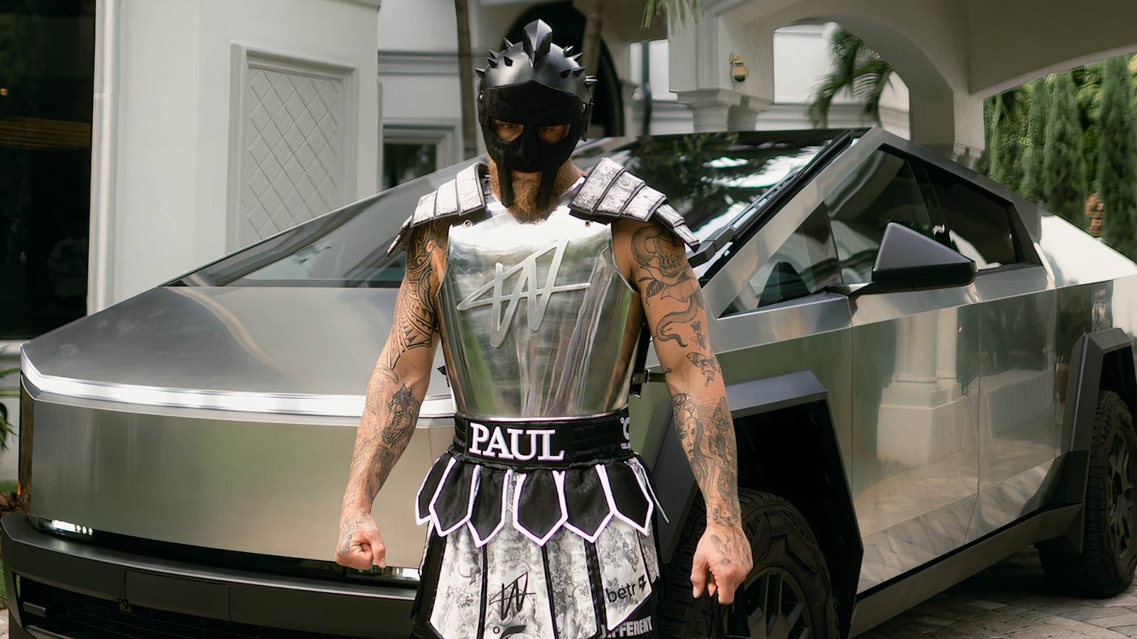 Jake Paul Unveils Ring-Walk Outfit in Front of a Cybertruck