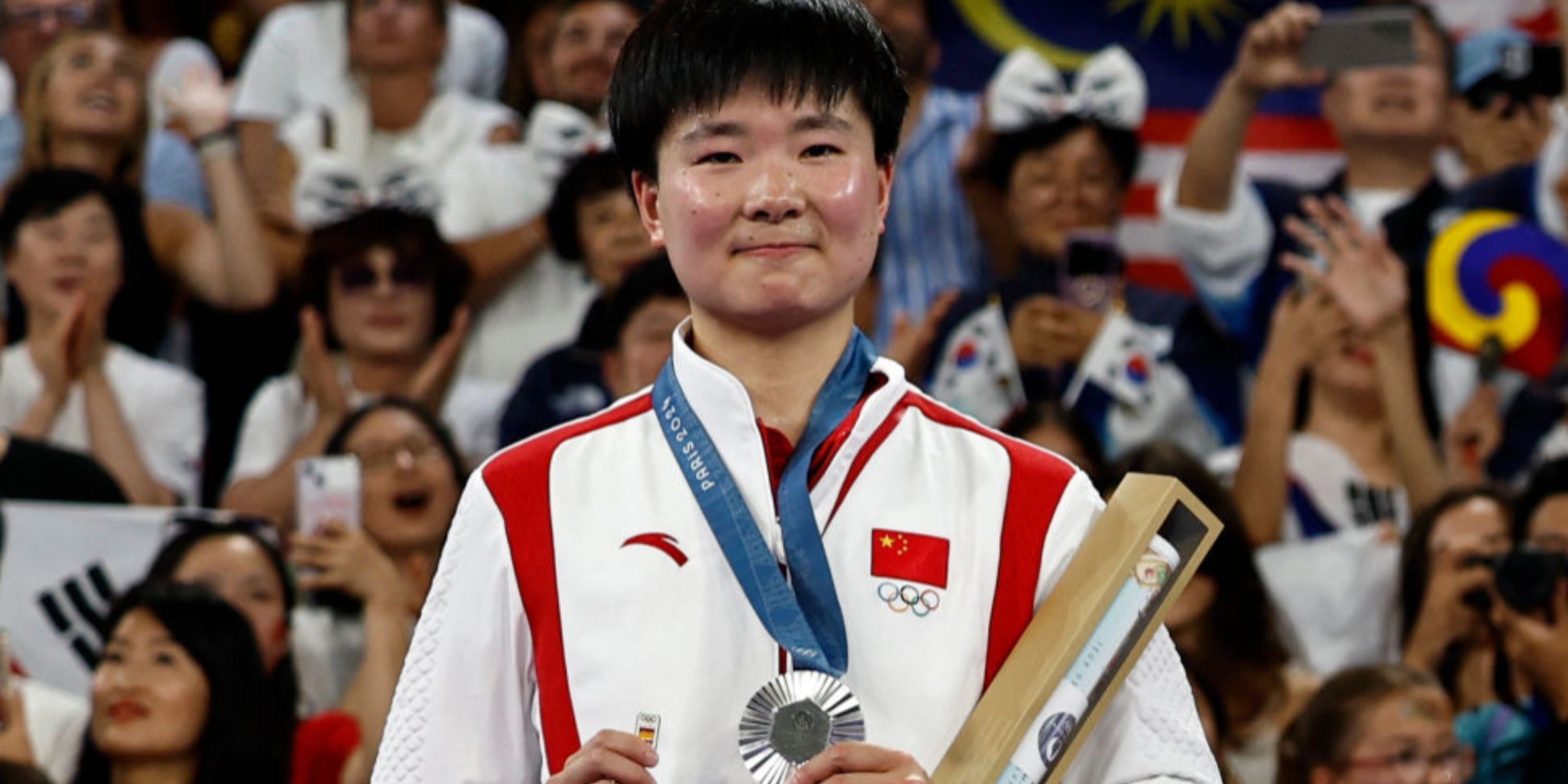 Why Chinese Badminton Star Held up Spain Flag During Medal Ceremony